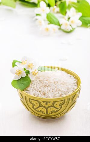 Bowl with rice jasmine and jasmine flower Stock Photo - Alamy
