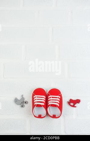 Frame of stylish kid's sneakers on green background, flat lay. Space ...