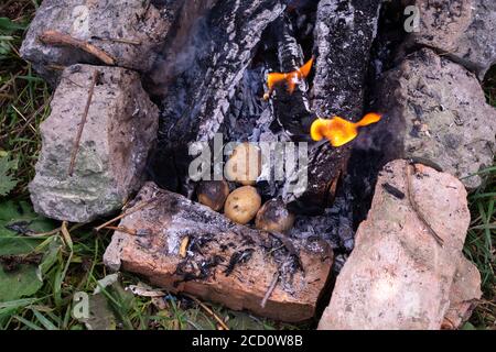 hot potato, potato on fire with flames Stock Photo - Alamy