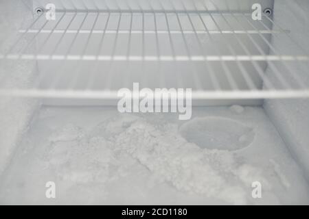 Ice buildup in freezer. Broken frozen refrigerator with built up ice ...