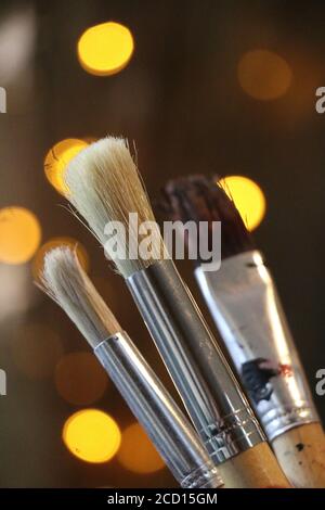 Many brush in paint close-up Stock Photo - Alamy