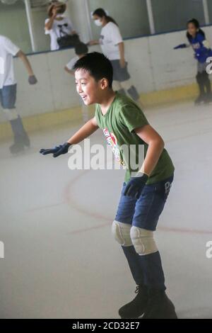 Citizens enjoy skating at an indoor ice rink to relieve scorching ...