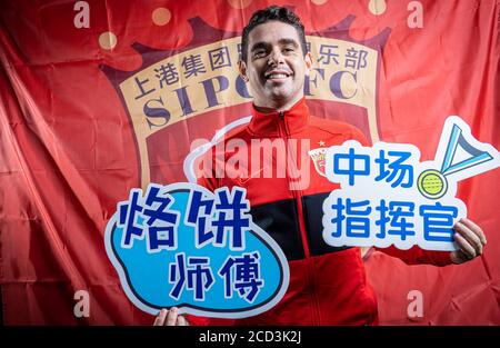 Brazilian football player Oscar of Shanghai SIPG celebrates after scoring against Tianjin TEDA ...