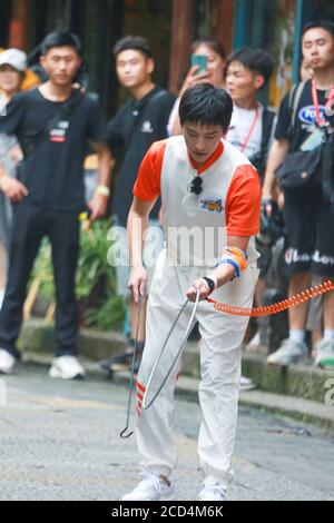 Chinese actor Yang Yang is seen playing a game during the recording of ...