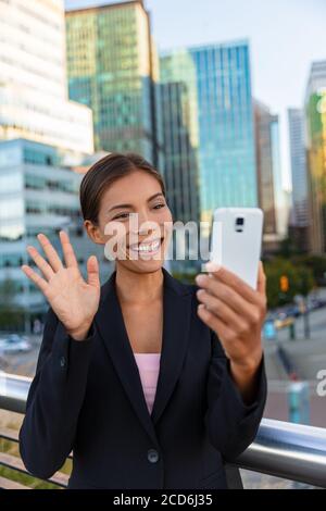 Blogger waving at smartphone camera for social media vlog. Influencer ...
