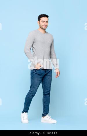 A handsome man with his hand in his pocket looking at the camera Stock ...