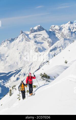 Alpinists during ascent with skis Stock Photo - Alamy