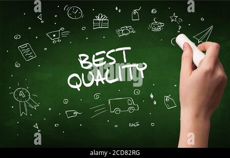 Hand drawing BEST QUALITY inscription with white chalk on blackboard ...