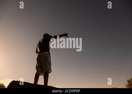 A low angle shot of a black male sitting on the staircase Stock Photo ...