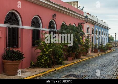 Colorfully painted houses on a narrow cobblestone street in the ...