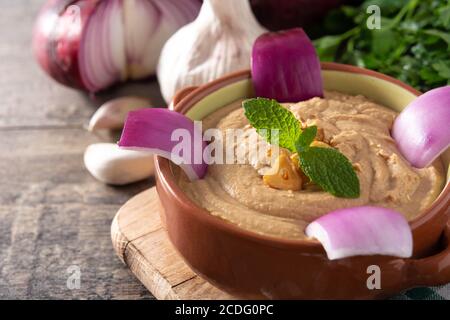 Gofio escaldado in bowl on wooden table.Typical canarian food Stock ...