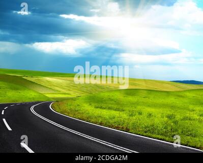 Empty curved road Stock Photo - Alamy
