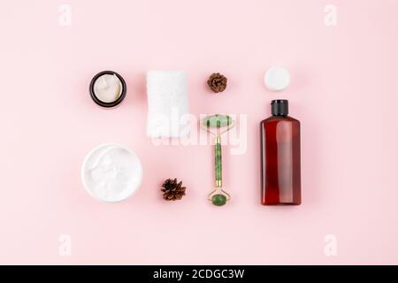 Natural skin care product. Open jar of moisturizing cream on green ...