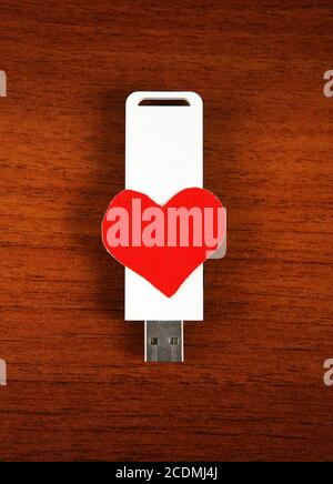 The red USB flash drive with heart and gems Stock Photo - Alamy