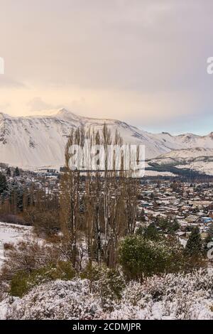 Scene view of Esquel city covered by snow after snowstorm during winter ...