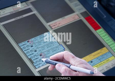 Digital flight progress strips, seen on an air traffic controller's ...