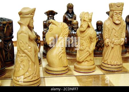 Closeup of chess figures on the board under the spotlight Stock Photo ...