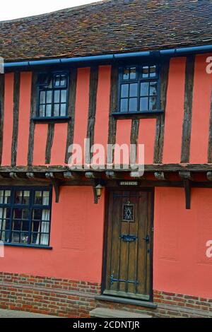 Traditional pink Suffolk house with exposed beams and thatched roof in ...