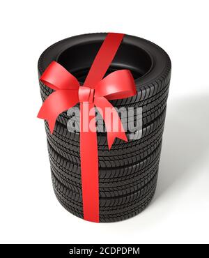 Tires as a gift. A set of four tires with a red gift ribbon with a bow ...