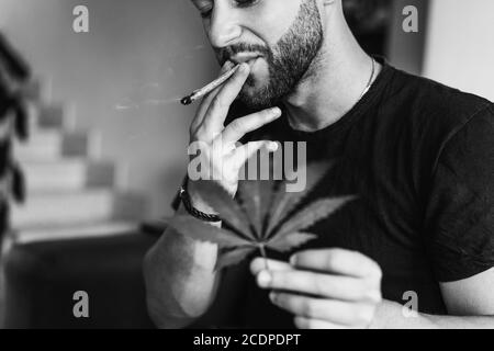 Young person smooking marijuana joint - Cannabis, stoner and weed ...