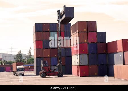 Empty container handler with side-lift spreader in yard Stock Photo - Alamy