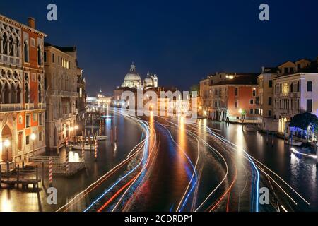 Busy Venice Grand Canal with light trails at night, Italy Stock Photo ...