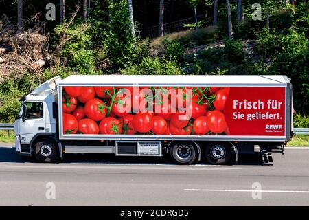 REWE truck on motorway. REWE operates approximately 3,300 supermarkets ...