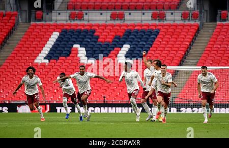 Arsenal celebrating winning the penalty shoot out to win the Community ...