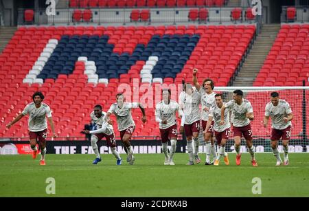 Arsenal celebrating winning the penalty shoot out to win the Community ...