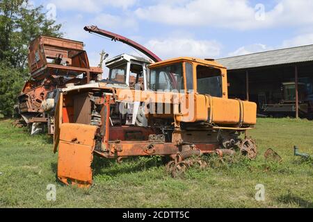 A closeup of old and rusty farming and agricultural equipment in a ...