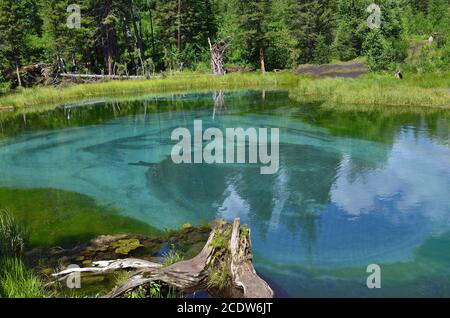 Amazing blue geyser lake in the mountains of Altai, Russia Stock Photo ...