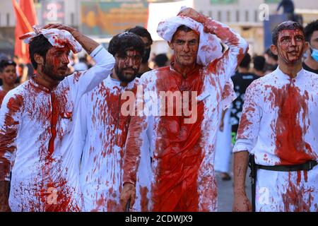 Baghdad, Iraq. 30th Aug, 2020. Shiite Muslims men hit their head with ...