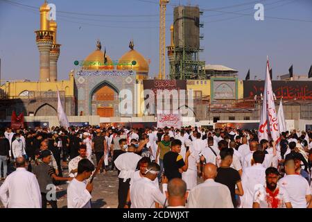 Baghdad, Iraq. 30th Aug, 2020. A Shiite Muslims man beats his back with ...