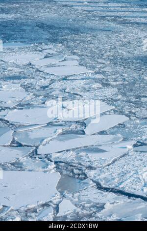 Aerial view of the ice texture broken into pieces of different shapes ...