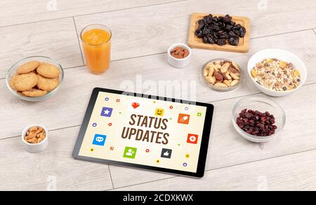 Healthy Tablet Pc compostion with STATUS UPDATES inscription, Social ...