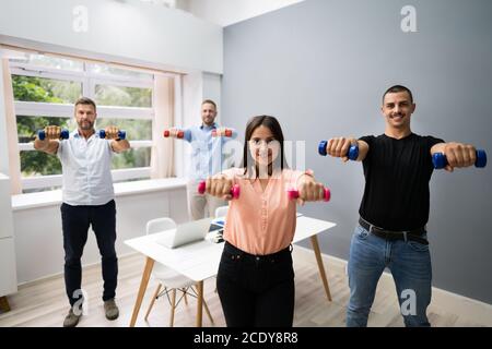 Office Wellness Exercises For Group Of Diverse People Stock Photo - Alamy