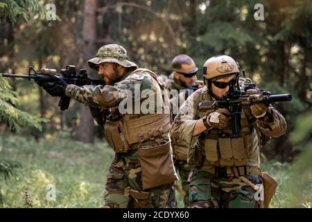 Group of soldiers in camouflage with rifles in hands Stock Photo - Alamy