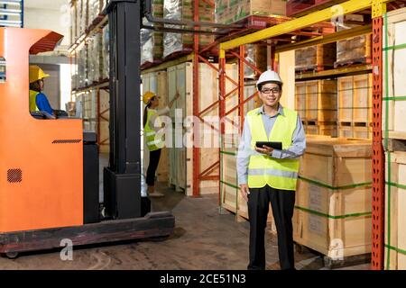 Portrait of Warehouse manager and worker Stock Photo - Alamy