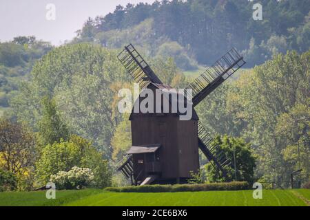 View of a well-preserved old post mill Stock Photo - Alamy