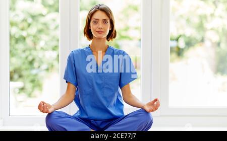 Nurse practicing Yoga at work Stock Photo - Alamy