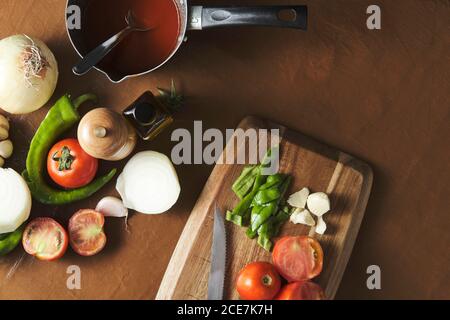 Chopped green garlic on a cutting board with knife Stock Photo - Alamy