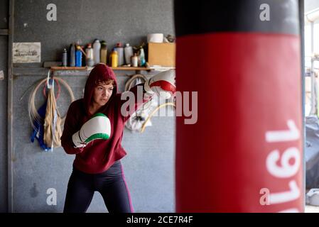 Determined sportsWoman shadow boxing in gym Stock Photo - Alamy