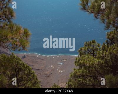 Spectacular scenery of calm sea surrounded by hills in overcast weather ...