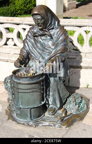 Bronze statue by Bruno Cuevas seated old woman selling roasted ...