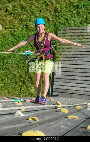 Abseiling in high ropes course Stock Photo - Alamy