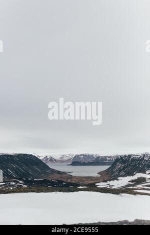 Aerial view of amazing land with snowy spacious terrain and mountains ...