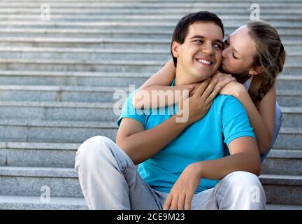Beautiful loving happy couple sitting in cafe and drinking coffee on ...