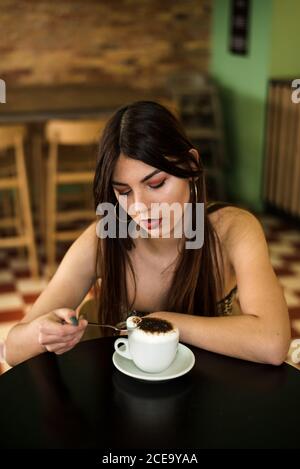 Beautiful lady sitting in cafe with coffee Stock Photo - Alamy