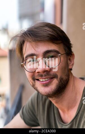 Attractive cheerful man looking at you Stock Photo - Alamy