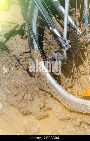 the Bicycle wheel is stuck in the mud. Close up Stock Photo - Alamy